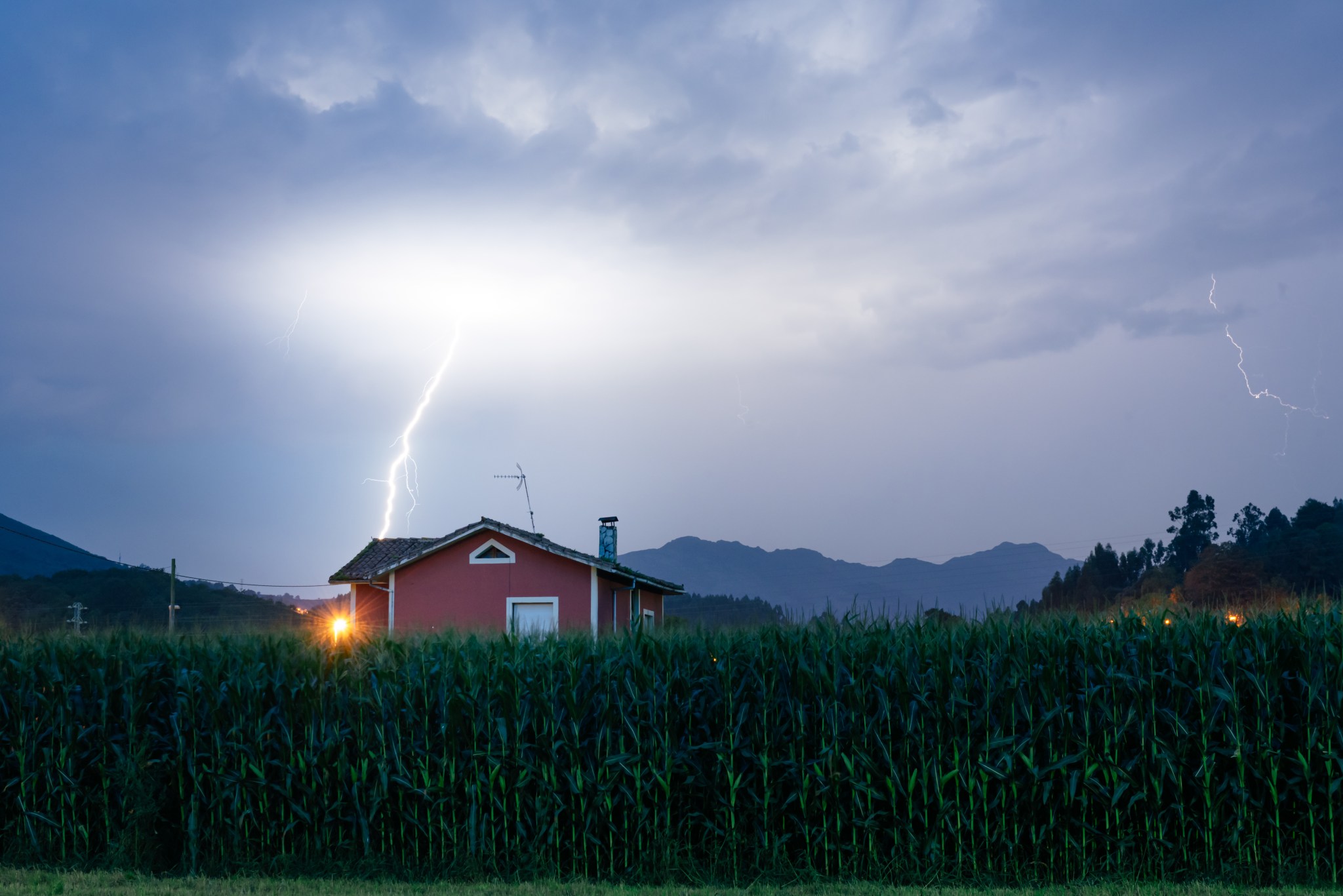lightning storm over country house – Monarch National Insurance Company